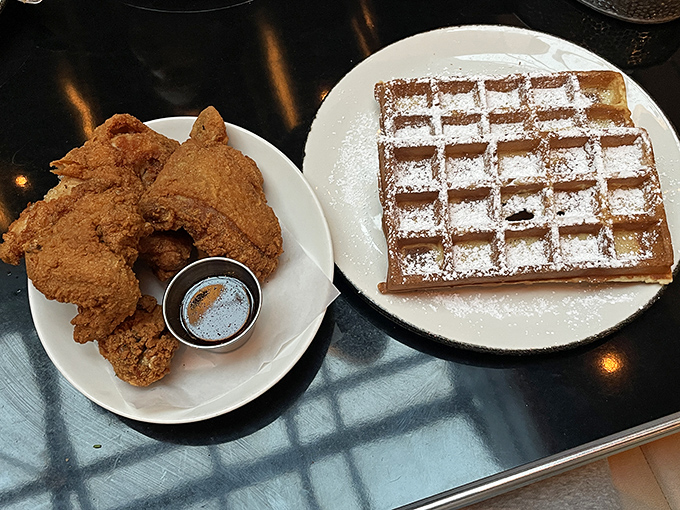 The star of the show: golden-brown chicken with a perfectly crisp exterior meets a Belgian waffle dusted with powdered sugar. It's the breakfast-dinner mashup that dreams are made of. 