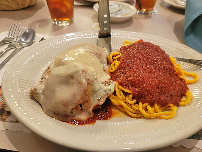 Behold the star attraction: chicken parmesan that could make angels weep. Golden, crispy exterior giving way to tender chicken beneath that magnificent cheese blanket.