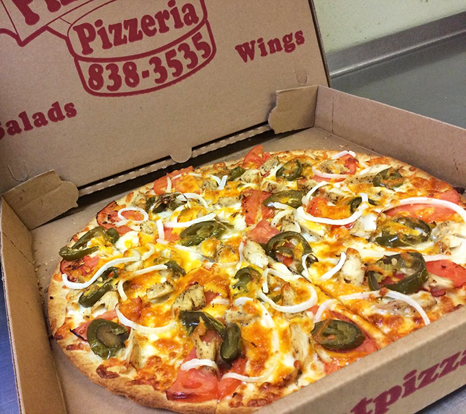 Jalape&ntilde;os and fresh veggies dance across this vibrant specialty pizza. The colorful medley promises a flavor fiesta that bridges Italian tradition with Mexican flair.
