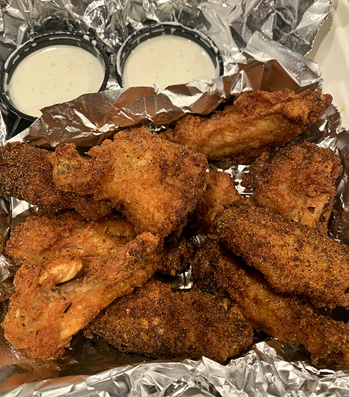 These aren't just wings; they're crispy, golden-brown masterpieces of culinary engineering that make you question why you ever ate wings anywhere else.