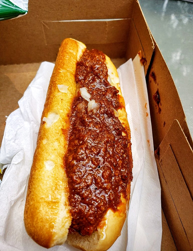 Chili dog nirvana! That rich, meaty sauce cascading over a perfectly cooked frank creates the kind of messy perfection worth traveling miles for.