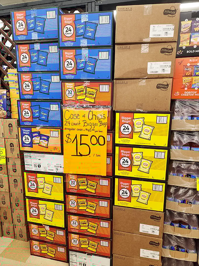 Snack heaven awaits! Cases of chips stacked like a carb-lover's dream, proving that good deals and guilty pleasures make perfect shopping companions.
