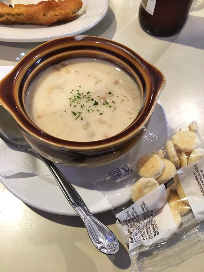 This isn't just clam chowder&mdash;it's a warm hug in a bowl, creamy and rich with a sprinkle of herbs that whispers, "Sit down, stay awhile."