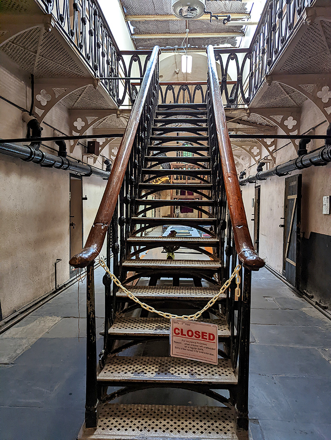 Victorian-era prison architects weren't big on accessibility. These ornate iron stairs, now roped off, once led to the upper cell blocks.