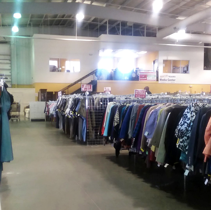 Men's clothing racks stretch toward the horizon like a well-dressed army awaiting deployment to your closet.