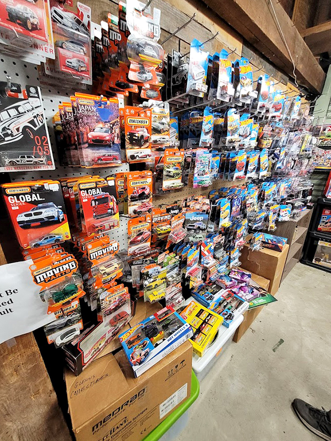 Hot Wheels heaven! This wall of miniature cars represents thousands of childhood dreams parked neatly on pegboard shelves.