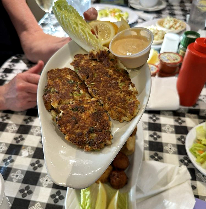 These golden-brown crab cakes aren't just food—they're an event. Packed with sweet lump crab meat and minimal filler, they're the Meryl Streep of seafood: consistently excellent and deserving of all awards.