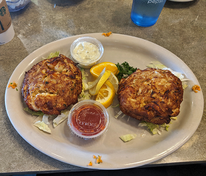 These golden-brown crab cakes are the reason people drive across county lines. More crab than cake, served with a side of coastal nostalgia.