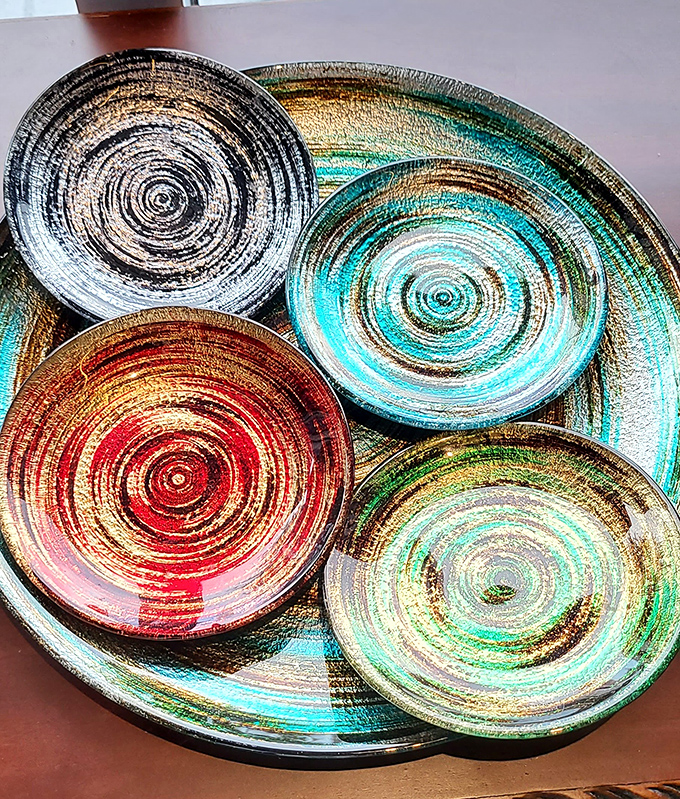 These aren't your grandmother's china patterns. These swirling, hypnotic plates transform any dinner party from "We're having lasagna" to "We're having an experience."