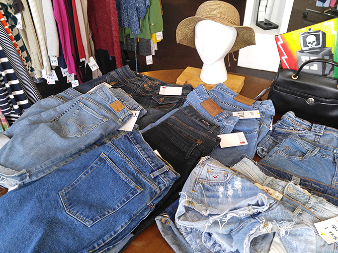 Denim paradise! A treasure trove of jeans in every wash and size imaginable, topped with a summer hat that's begging for a beach day.