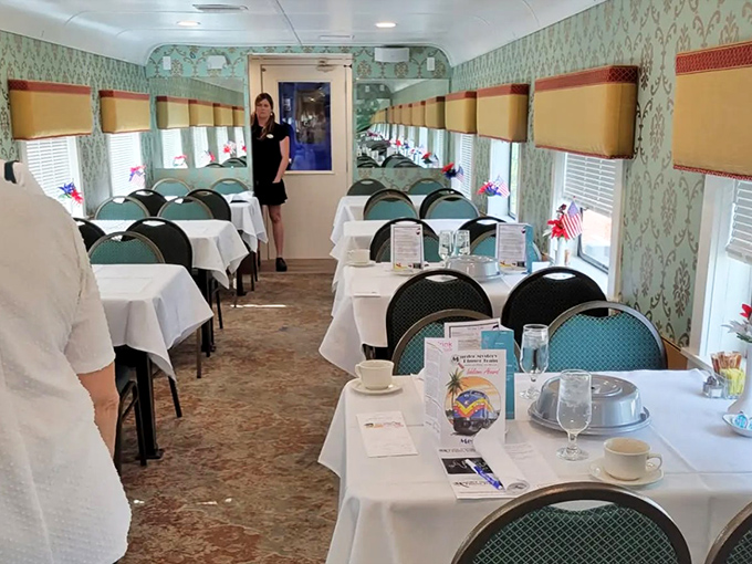 Elegant place settings await diners in the vintage dining car, where the gentle sway of the train somehow makes everything taste better.