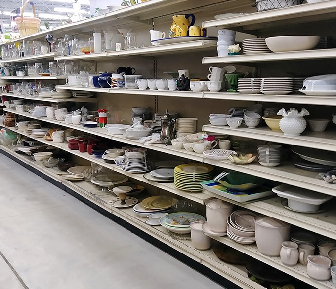 Dish paradise! Every plate tells a story, and these shelves hold enough tales to fill a library of family dinners.