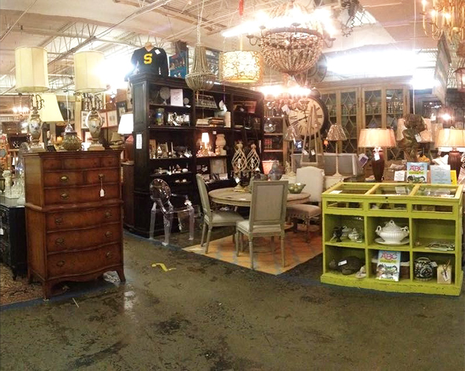 Chandeliers hang like crystalline jellyfish in an ocean of furniture. This booth could furnish a Wes Anderson film set or your eclectic living room.