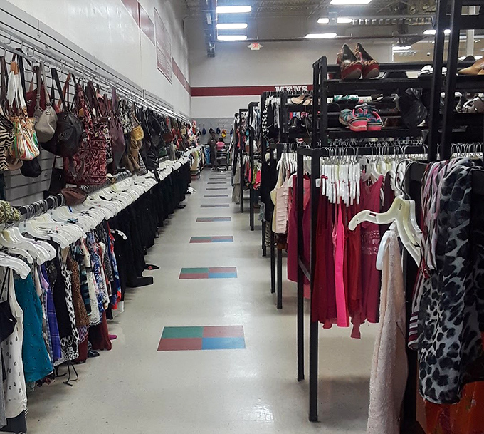 Another aisle, another style era. The colorful clothing corridors create a textile time machine where yesterday's trends await tomorrow's innovators.