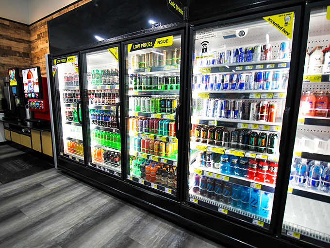 A rainbow of liquid refreshment awaits behind glass doors. It's like the Louvre of hydration options, but with more Mountain Dew.