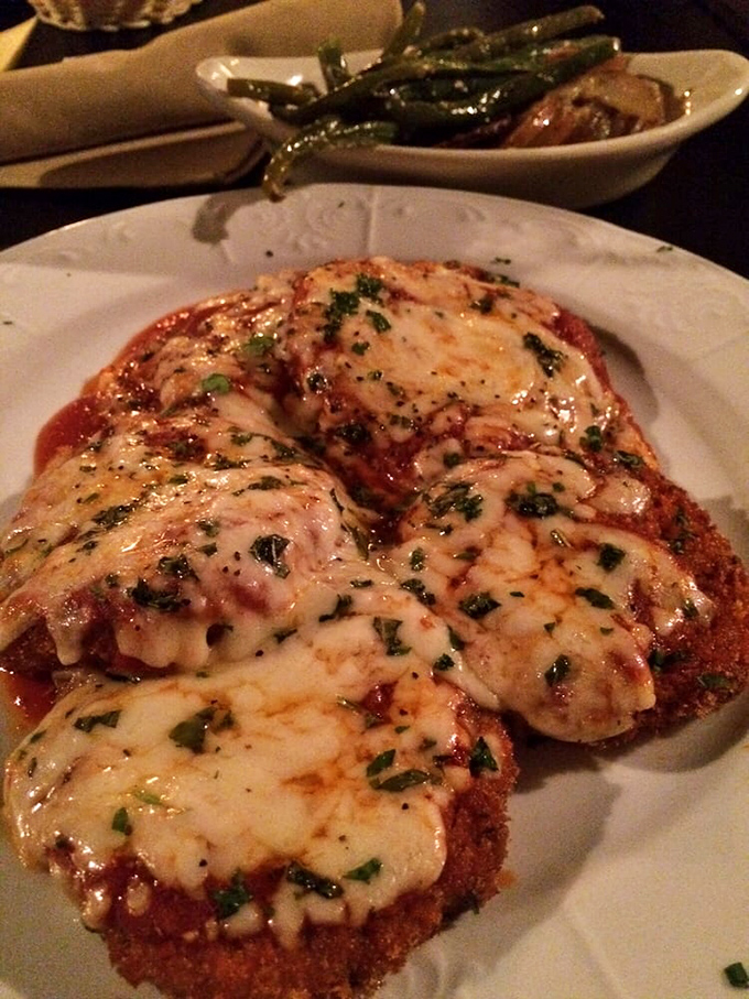 Eggplant parmigiana that doesn't just sit on the plate&mdash;it performs! Crispy exterior, melty cheese canopy, and that marinara singing backup.