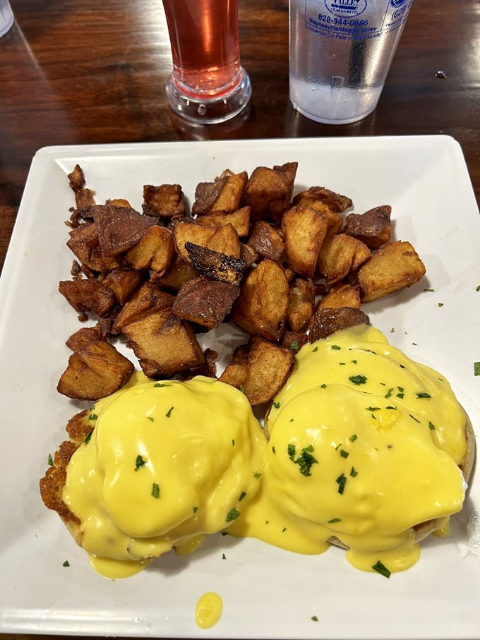 Eggs Benedict that would make a French chef weep with joy. Those home fries deserve their own fan club.