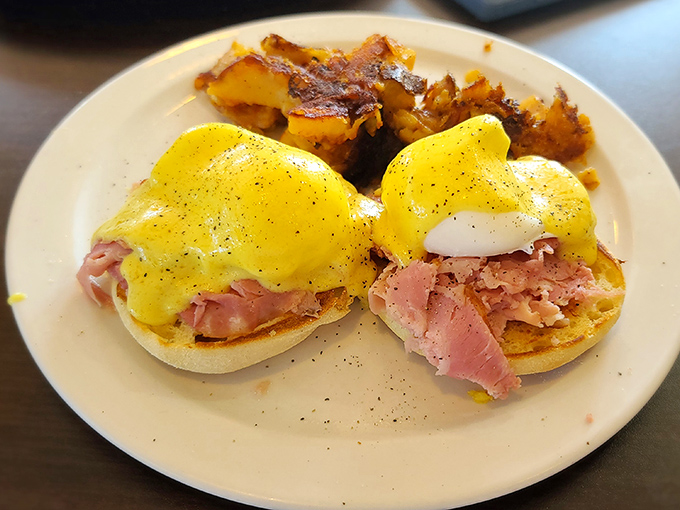 Eggs Benedict that would make a French chef weep with joy &ndash; perfectly poached eggs, savory ham, and hollandaise sauce that's basically liquid sunshine.