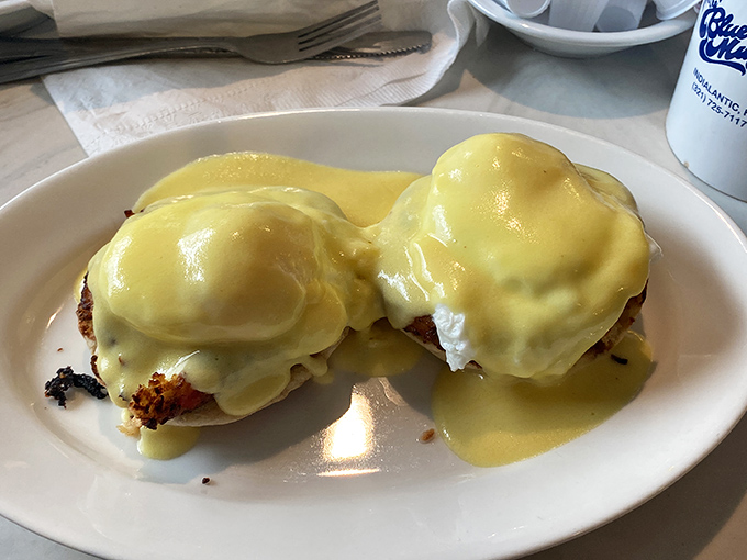 These Eggs Benedict aren't just breakfast, they're a sunrise masterpiece &ndash; perfectly poached eggs draped in hollandaise that flows like liquid gold.