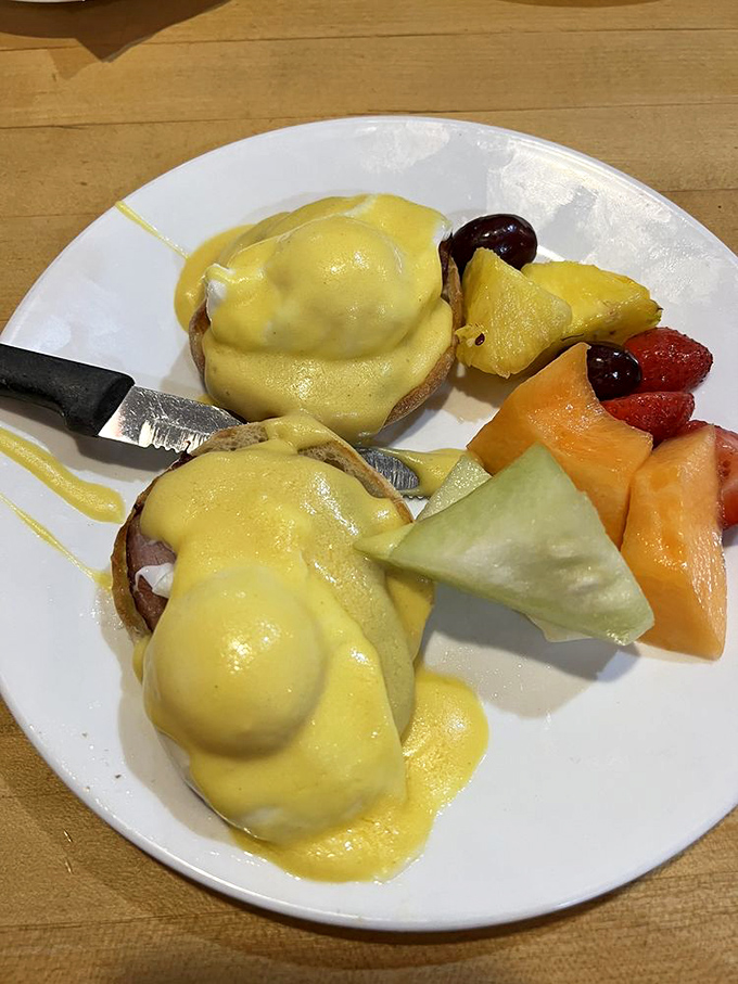 Eggs Benedict that would make a French chef weep with joy&mdash;perfectly poached eggs draped in hollandaise with a side of fresh fruit.