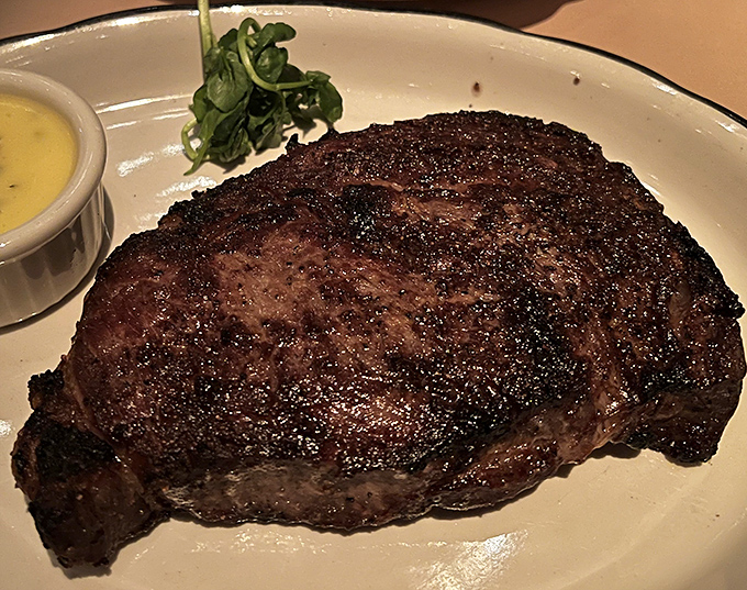 The filet mignon arrives with a crust that should win awards, while the interior remains as tender as a love letter.