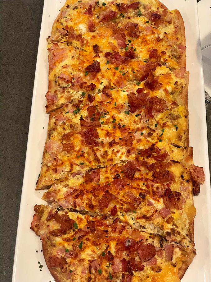 This isn't just flatbread; it's a masterclass in balance&mdash;crispy edges, melty cheese, and that perfect ratio of ham to bacon that makes you forget to take photos first.