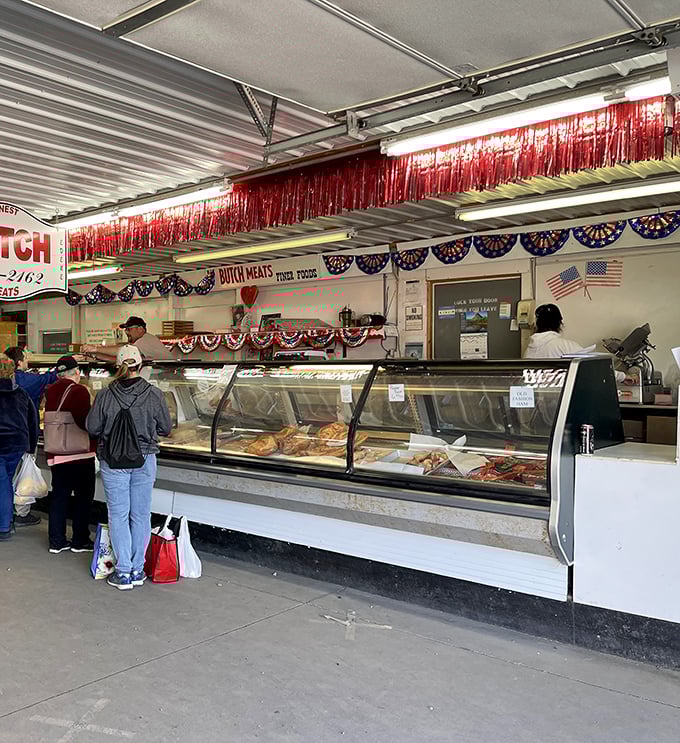 The Dutch Meats counter draws loyal customers like a beacon. Nothing says "successful flea market trip" like heading home with both antiques and fresh kielbasa.