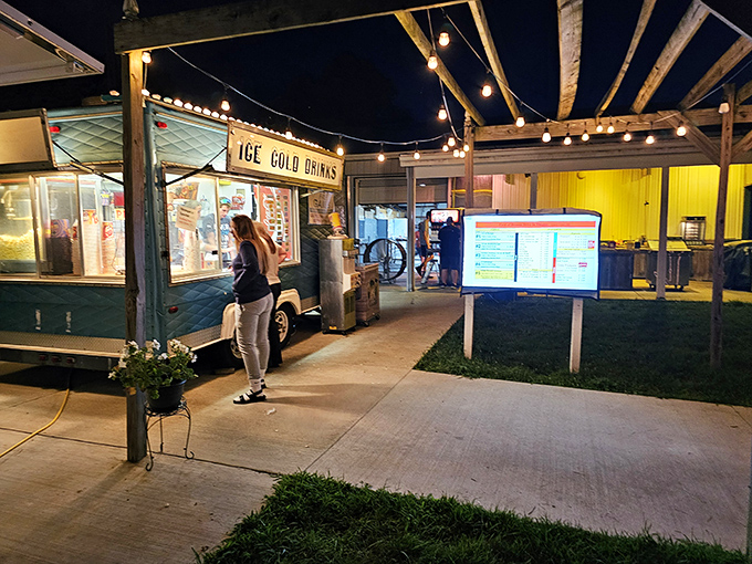 Ice Cold Drinks isn't just a sign&mdash;it's a promise of refreshment under string lights while intermission conversations flow as freely as the soda.