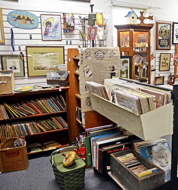 Literary treasures and vintage vinyl share space with framed nostalgia, creating the perfect hunting ground for Sunday afternoon explorers.