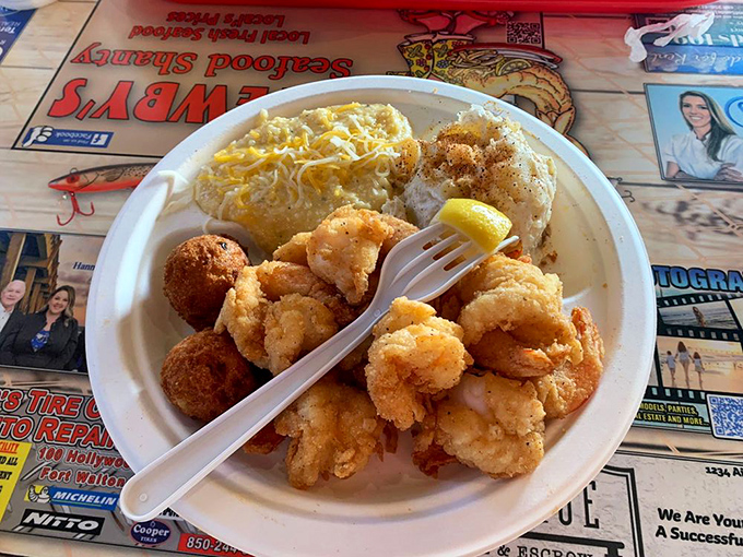 Golden-fried popcorn shrimp that pop with flavor alongside creamy cheese grits &ndash; a plate that whispers "you're definitely in the South now."