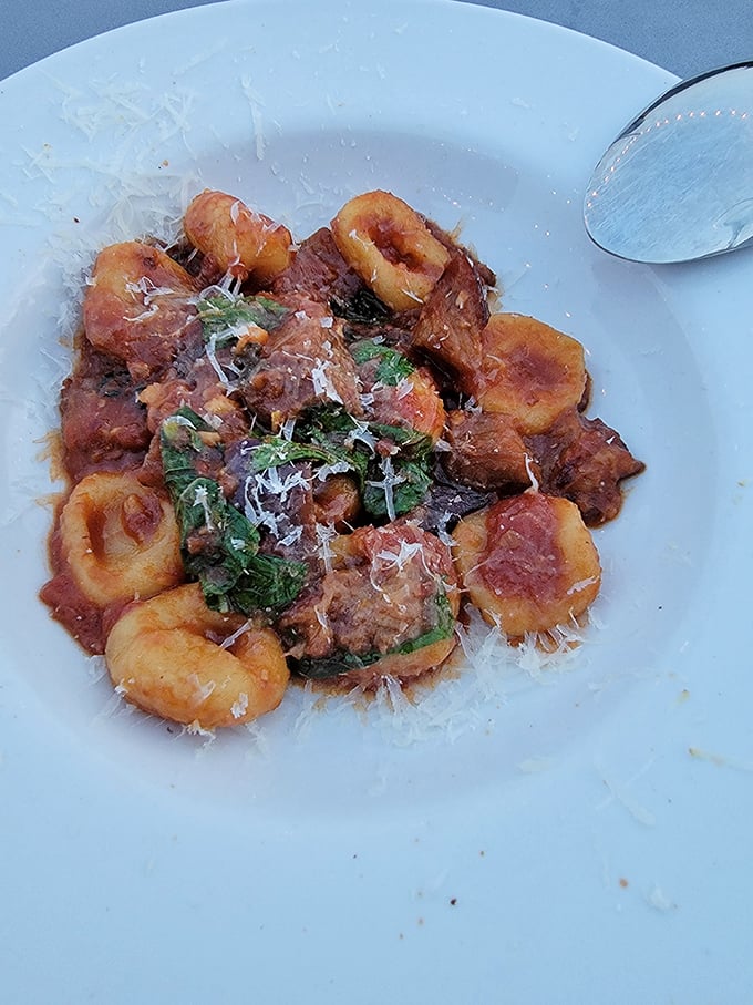 The legendary gnocchi sardi that launched a thousand return visits. These little pasta shells cradle the perfect balance of eggplant and chili heat.