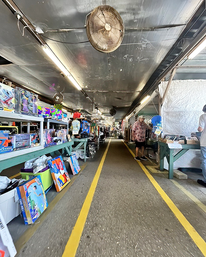 Follow the yellow-lined road through this marketplace maze, where overhead fans provide the soundtrack to your treasure hunt.