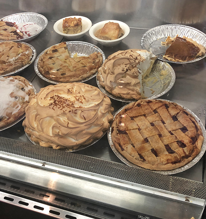 Pie paradise! This display case is the reason elastic waistbands were invented. That lattice crust is practically whispering your name.