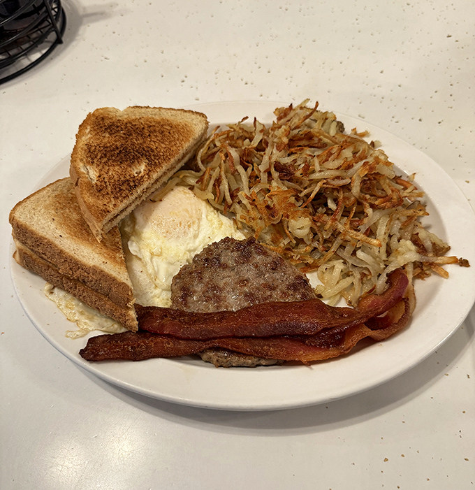 Breakfast perfection: crispy hash browns with that golden-brown exterior that makes the fork's first crunch so satisfying.