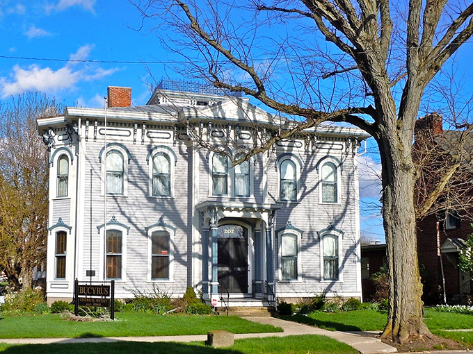 This stately white Victorian home stands as elegant testimony to a time when craftsmanship mattered and front porches were social networks.