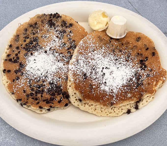 These chocolate chip pancakes aren't trying to reinvent breakfast; they're just perfecting it with a dusting of powdered sugar and a side of nostalgia.