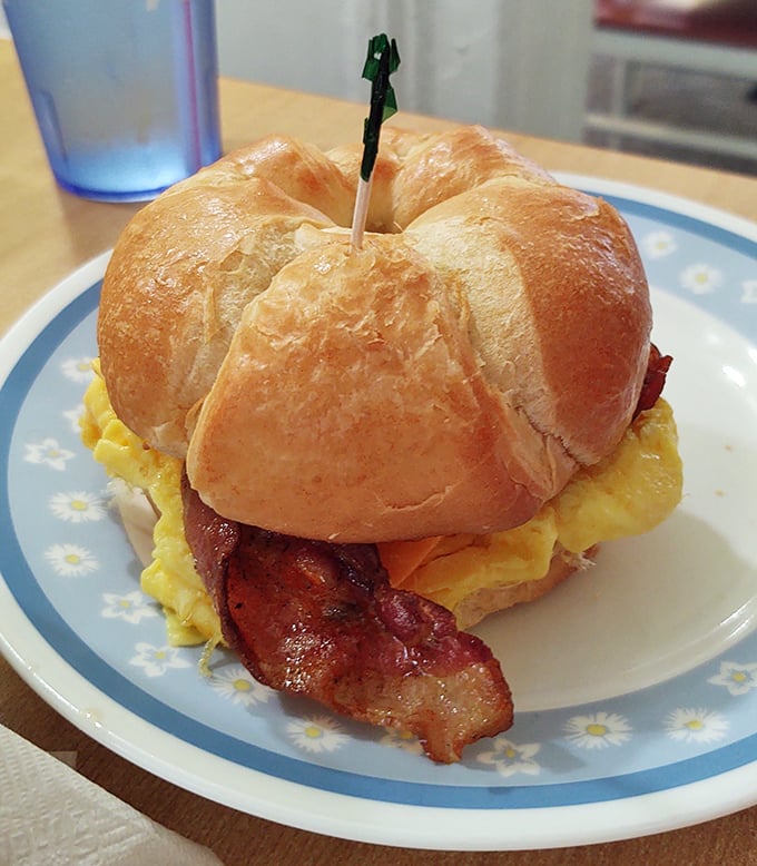 Golden pancakes stacked like edible skyscrapers, proving that architecture can indeed be delicious and syrup-worthy.
