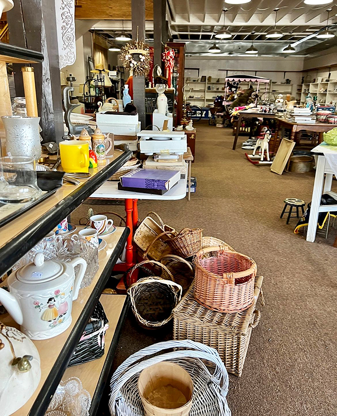 Household treasures line shelves like a museum of domestic life, where every teapot has witnessed countless conversations.