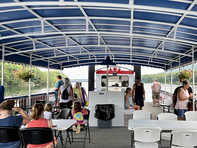 All aboard for memories! Inside the Hiawatha, families gather under the blue canopy, proving some experiences still outrank screen time.