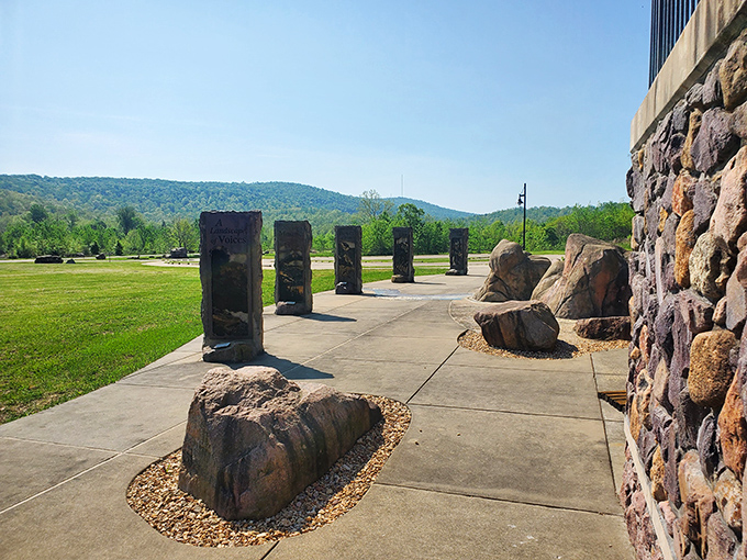 A stone monument garden welcomes visitors, each rock a silent storyteller of the park's volcanic origins and resilient history.