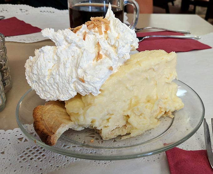 This coconut cream pie doesn't just satisfy a sweet tooth &ndash; it creates a lifelong commitment. That mountain of whipped cream deserves its own zip code.
