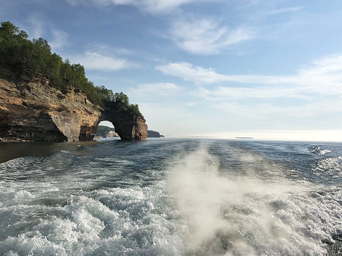 Nature's perfect infinity pool: Lake Superior stretches to the horizon while storm clouds gather for a dramatic backdrop.