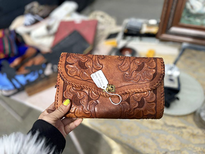 This hand-tooled vintage leather clutch has stories to tell. Someone's grandmother carried this to dinner parties where martinis flowed freely.