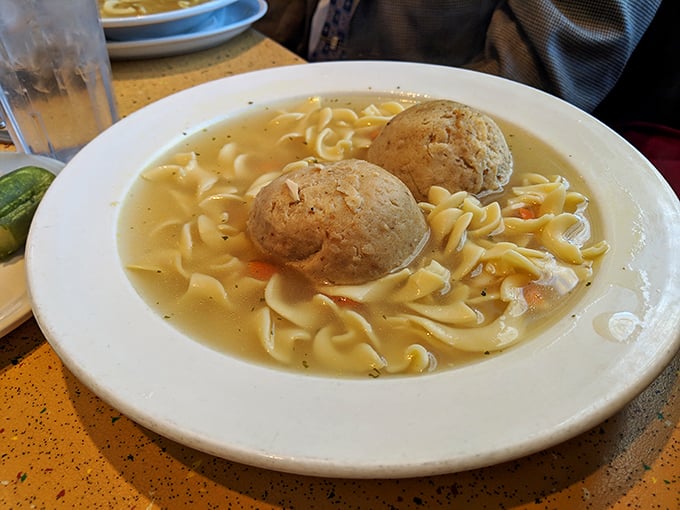 Behold the matzo ball soup&mdash;two perfect dumplings floating in golden broth like edible life preservers for your soul.