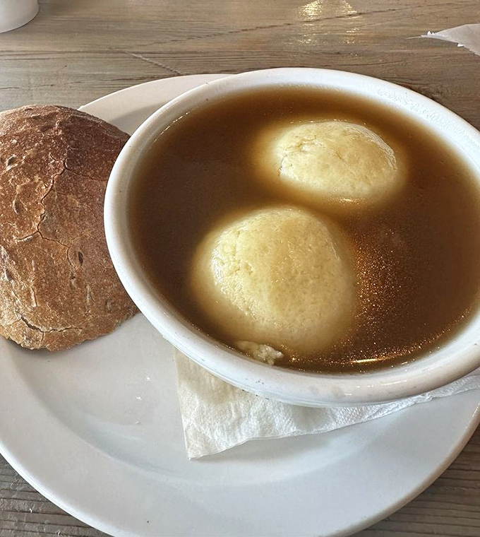 Matzo ball soup that would make your grandmother nod in approval. Those fluffy dumplings float like clouds in golden broth&mdash;comfort in a bowl.