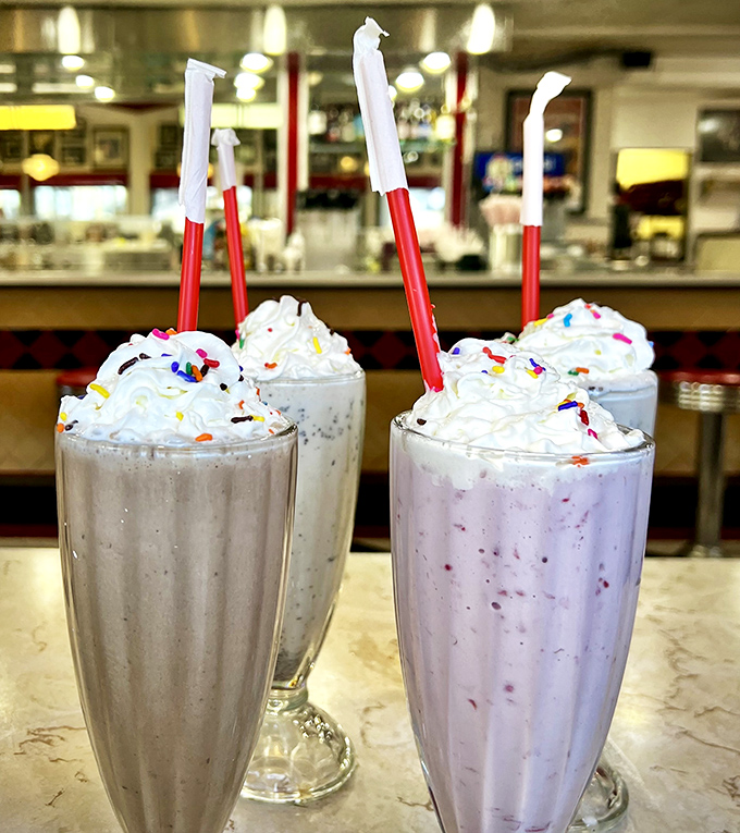These aren't just milkshakes; they're creamy works of art that require serious straw strength and zero guilt. The sprinkles aren't optional&mdash;they're essential joy particles.