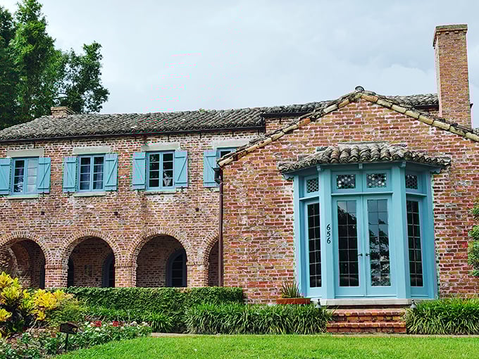 This Mediterranean-inspired architectural gem showcases Winter Park's historic charm, where blue shutters pop against weathered brick like a Floridian postcard come to life.
