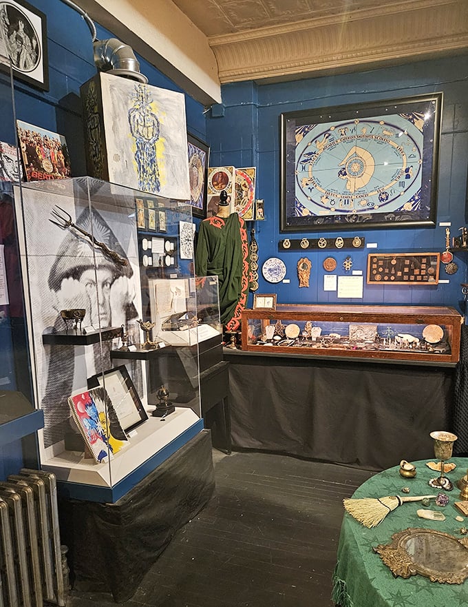 Blue walls showcase an eclectic collection spanning centuries of occult history. That circular zodiac chart would make even your skeptical brother-in-law pause and reconsider his horoscope.