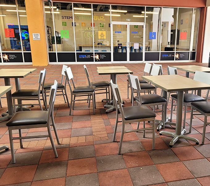 Even the outdoor seating areas maintain that Florida-meets-Mediterranean charm. Perfect for resting weary shopping muscles between stores.