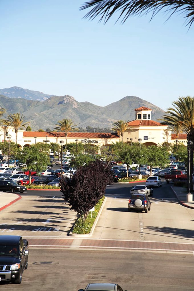 Mountains frame this shopping mecca like nature's way of saying, "Go ahead, treat yourself. You're on vacation even if you live here."
